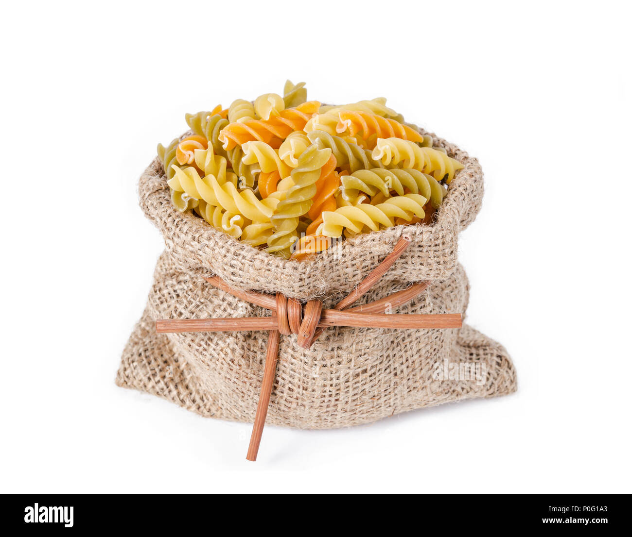 Dry italian pasta or macaroni pasta in sack back on white background ...