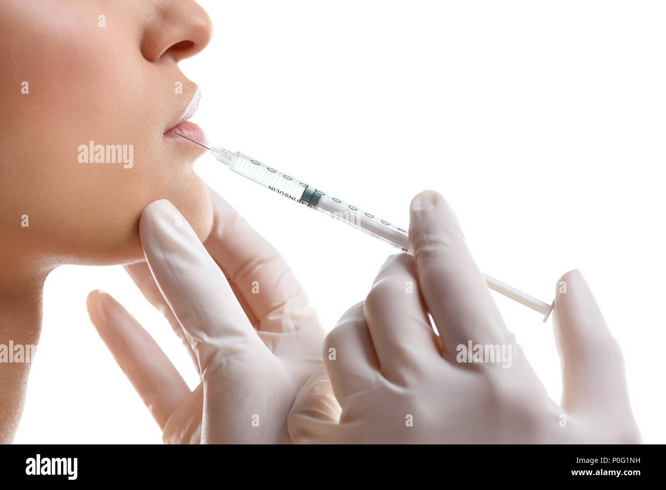 Portrait of attractive woman getting injection isolated on white Stock ...