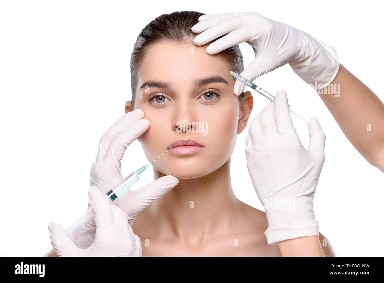 Portrait of attractive woman getting injection isolated on white Stock ...