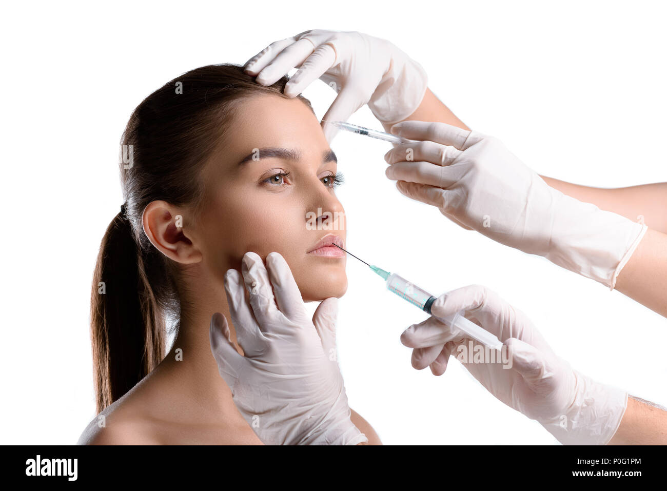Portrait of attractive woman getting injection isolated on white Stock ...