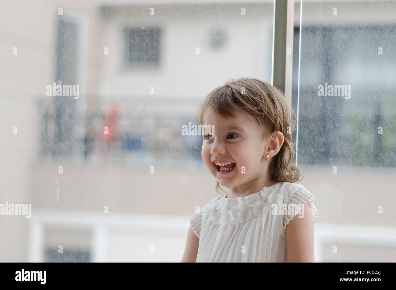 Small angel beauty with sparkling sky in the eyes Stock Photo - Alamy