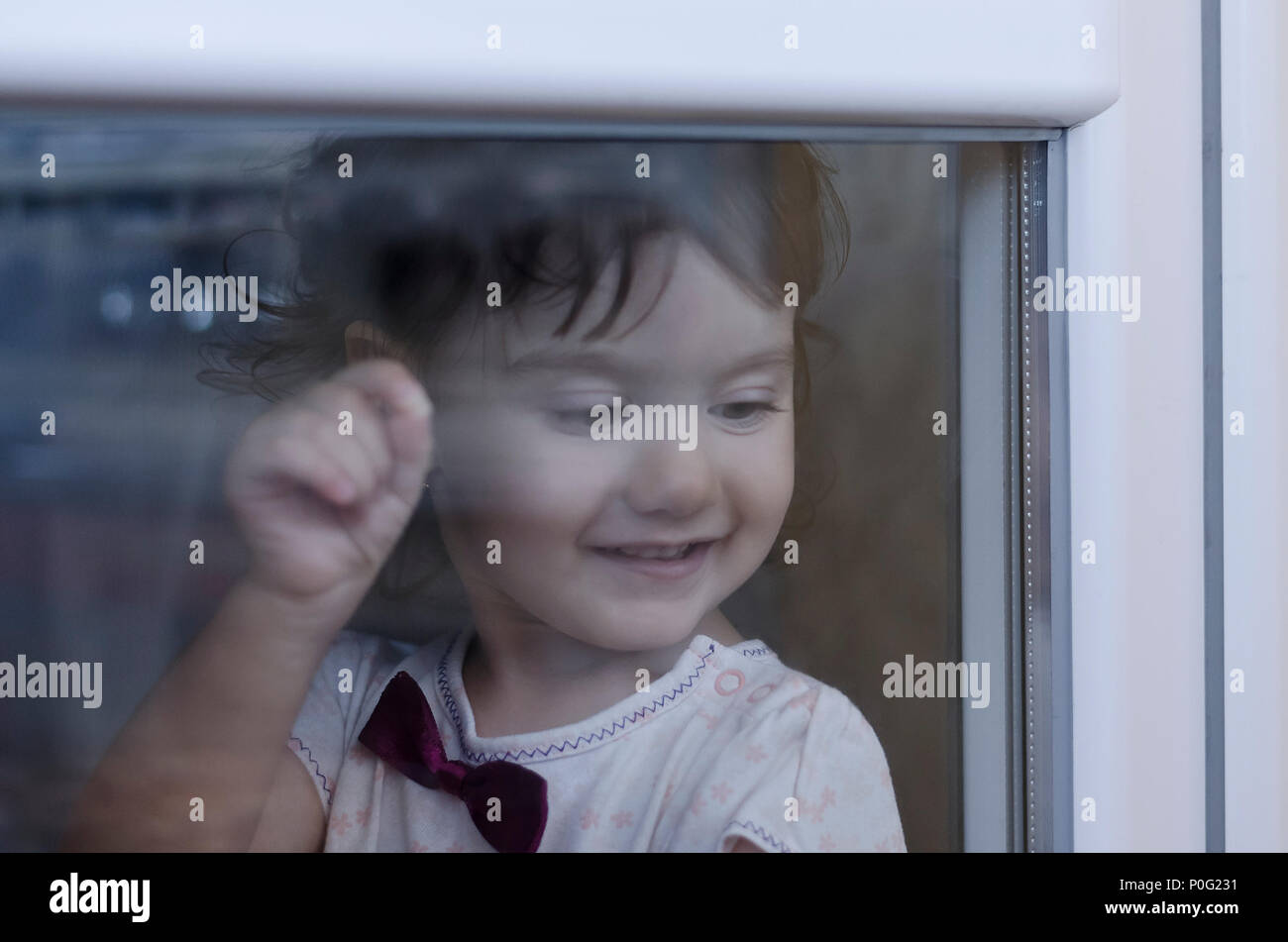 Small angel beauty with sparkling light in the eyes Stock Photo - Alamy