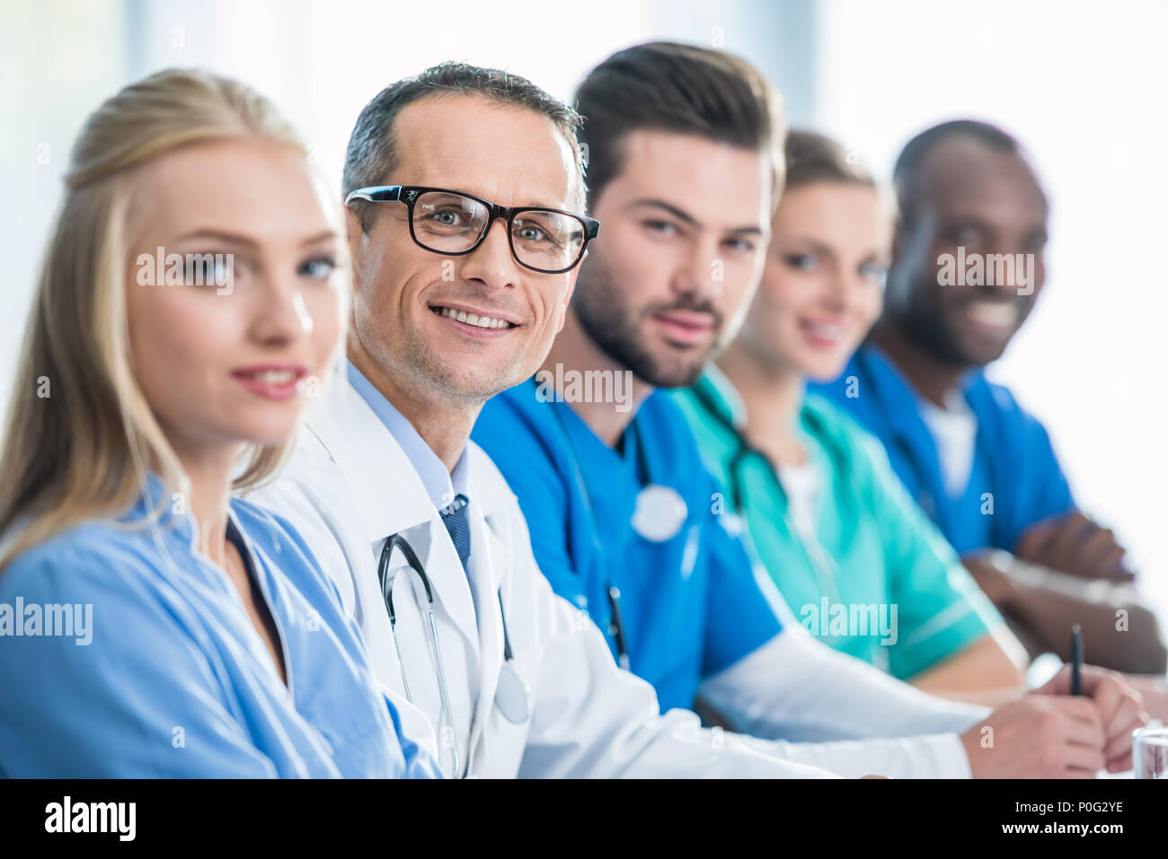 Group doctors nurses sitting hi-res stock photography and images - Alamy