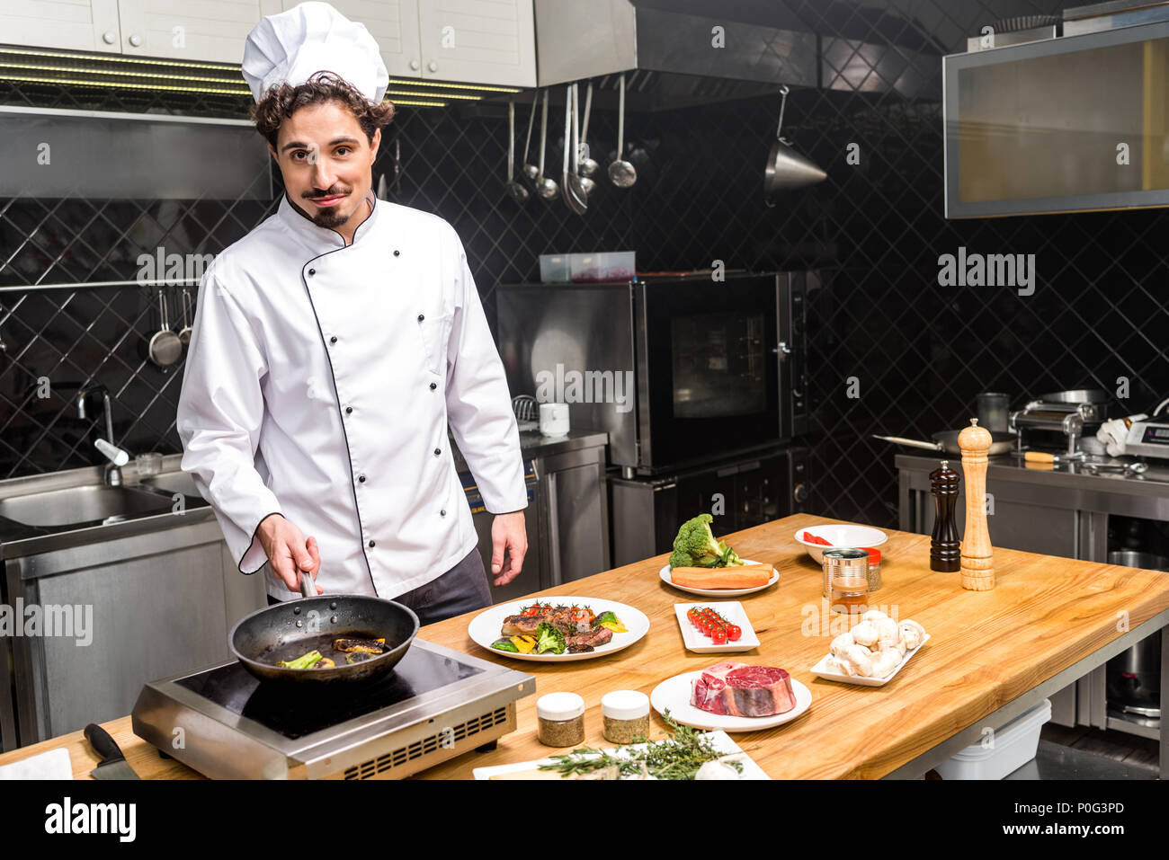 Handsome chef looking meal hi-res stock photography and images - Alamy