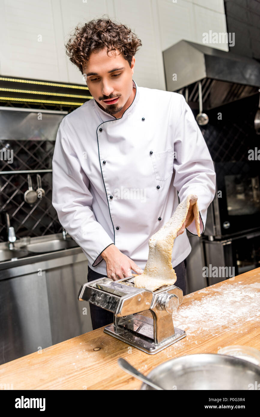 Young man making pasta hi-res stock photography and images - Alamy