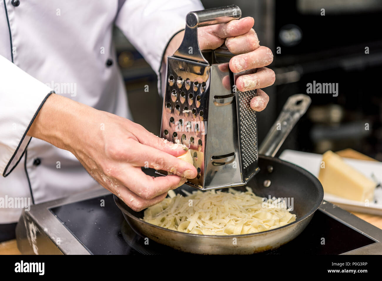 Grating cheese grater hands hi-res stock photography and images - Alamy