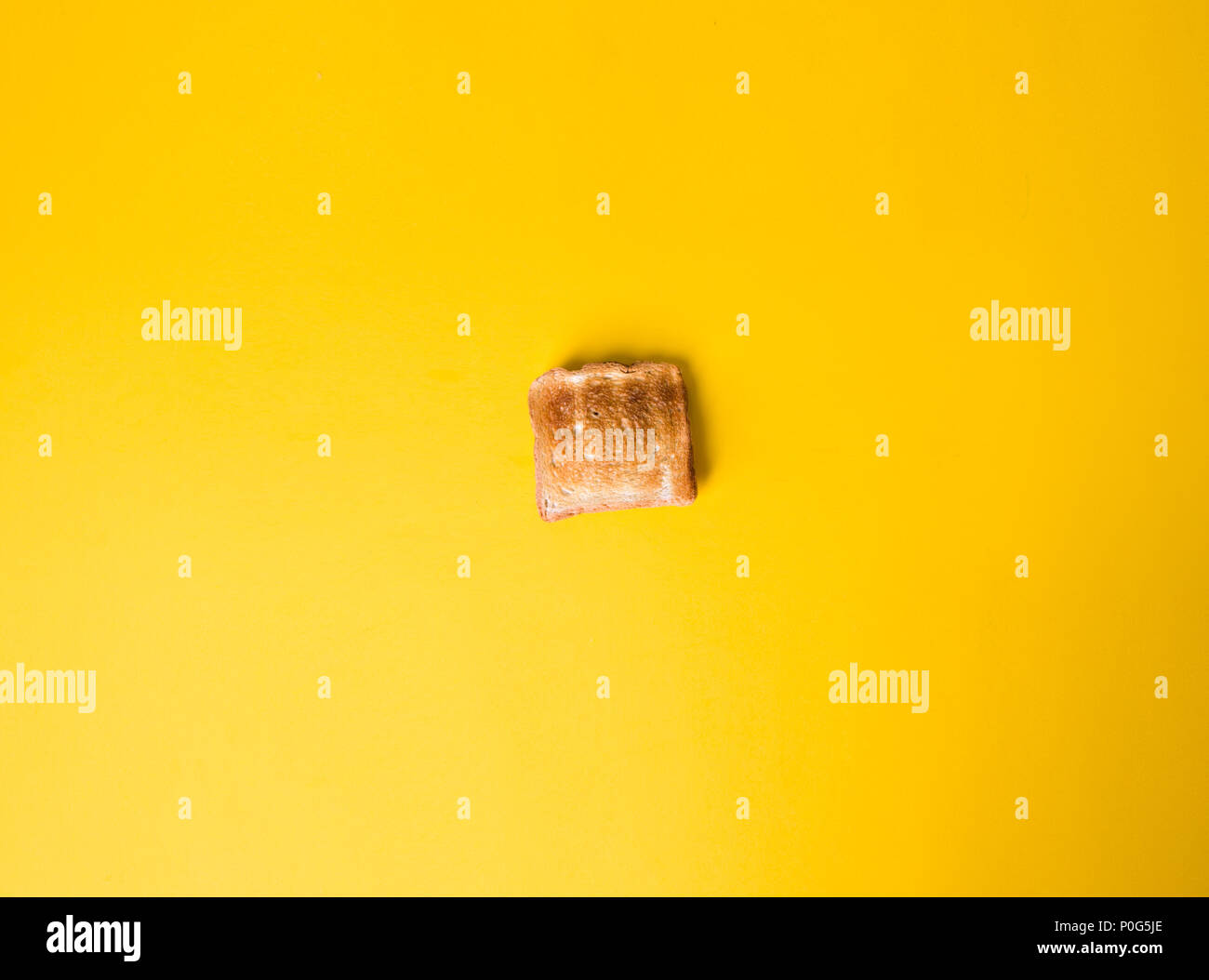 scalded toasted piece of bread toast on a yellow background, flat style ...