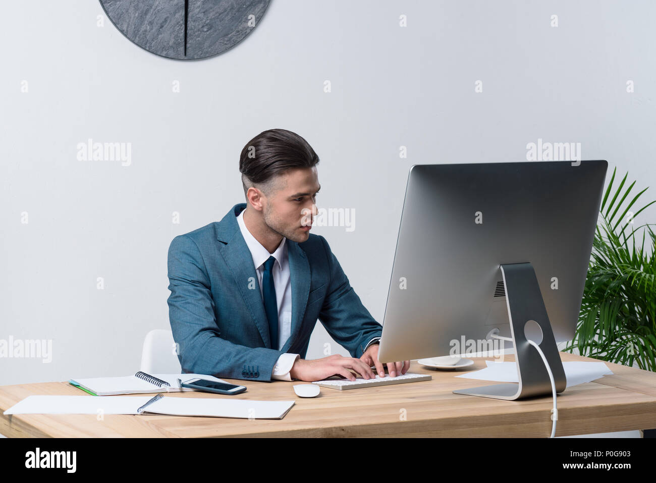 Focused man using desktop computer hi-res stock photography and images ...