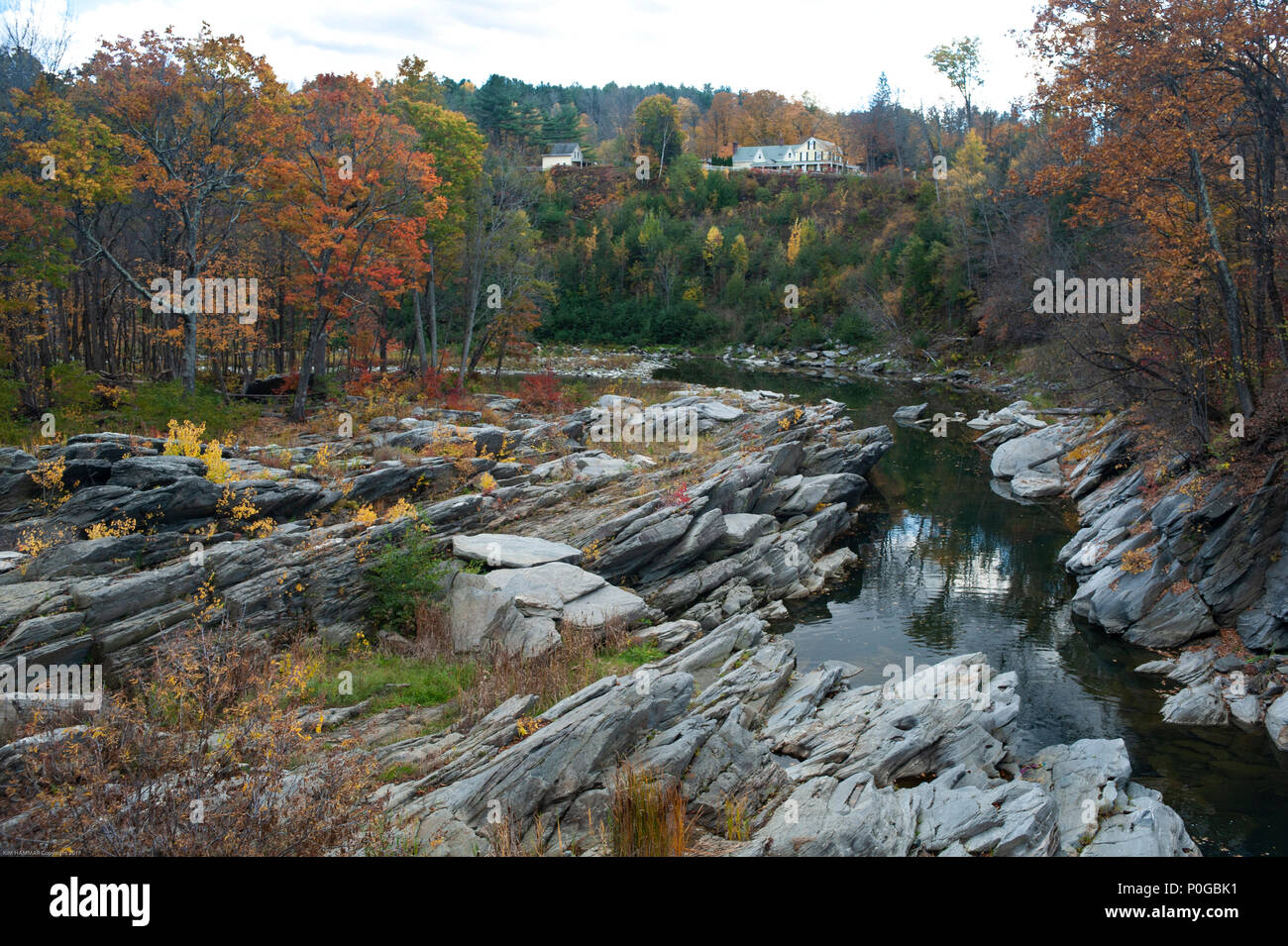 The Ottauquechee River in Quechee, Vermont in brilliant autumn colors ...