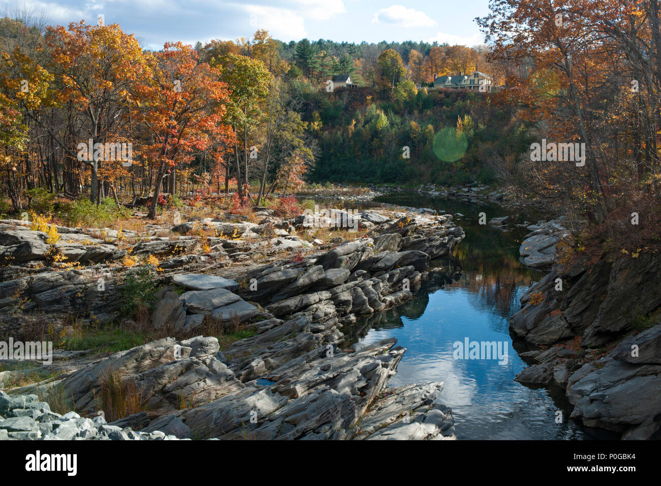 The Ottauquechee River in Quechee, Vermont in brilliant autumn colors ...