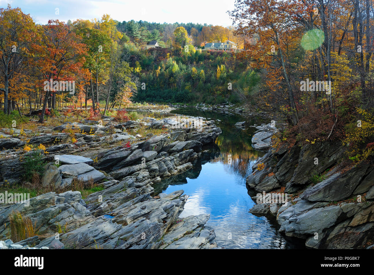 The Ottauquechee River in Quechee, Vermont in brilliant autumn colors ...