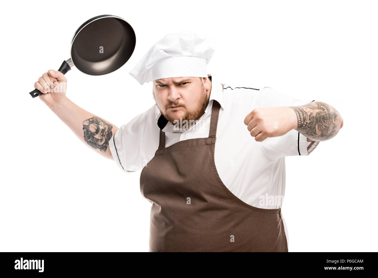 angry chef holding frying pan and looking at camera isolated on white ...