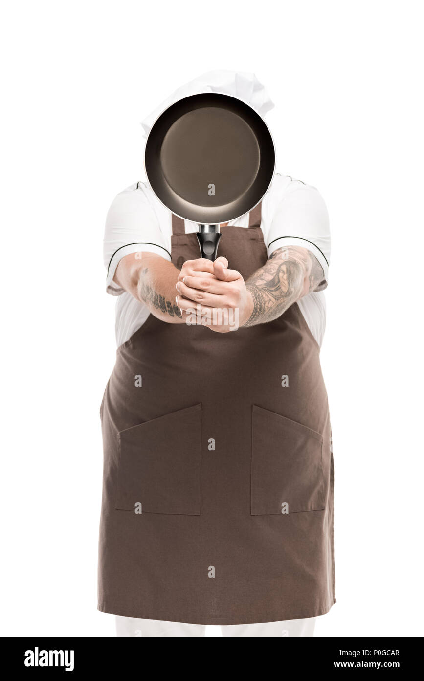 chef covering face with frying pan in hands isolated on white Stock ...