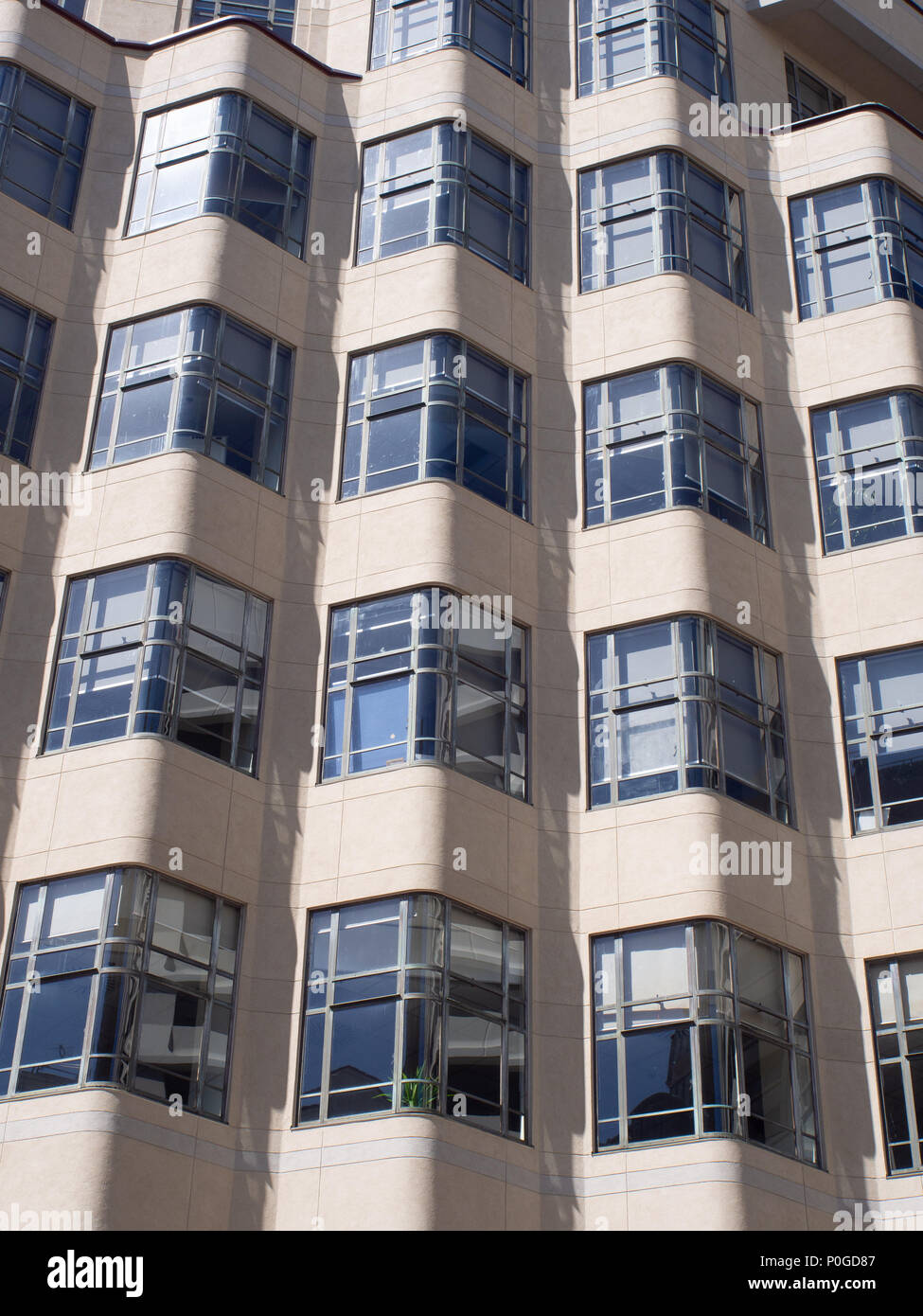 Windows Of An Apartment Building Stock Photo - Alamy