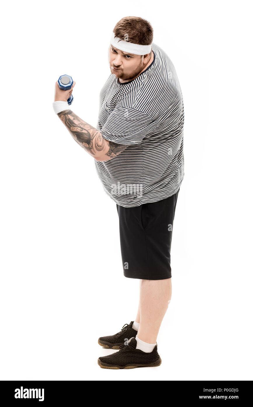 fat man flexing biceps with dumbbell and looking at camera isolated on ...