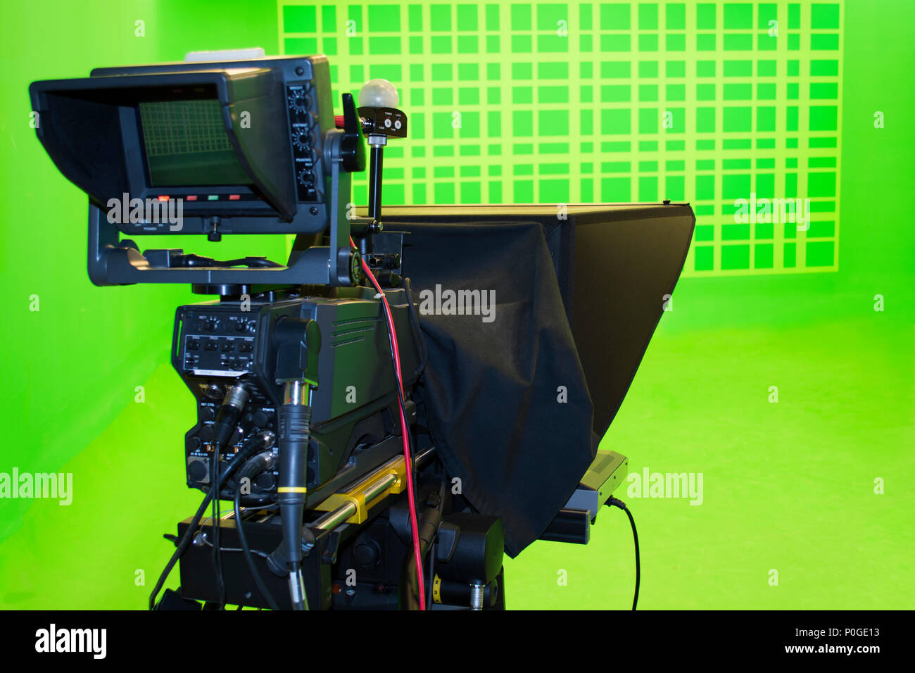Broadcast television studio camera in green screen studio room with LED ...