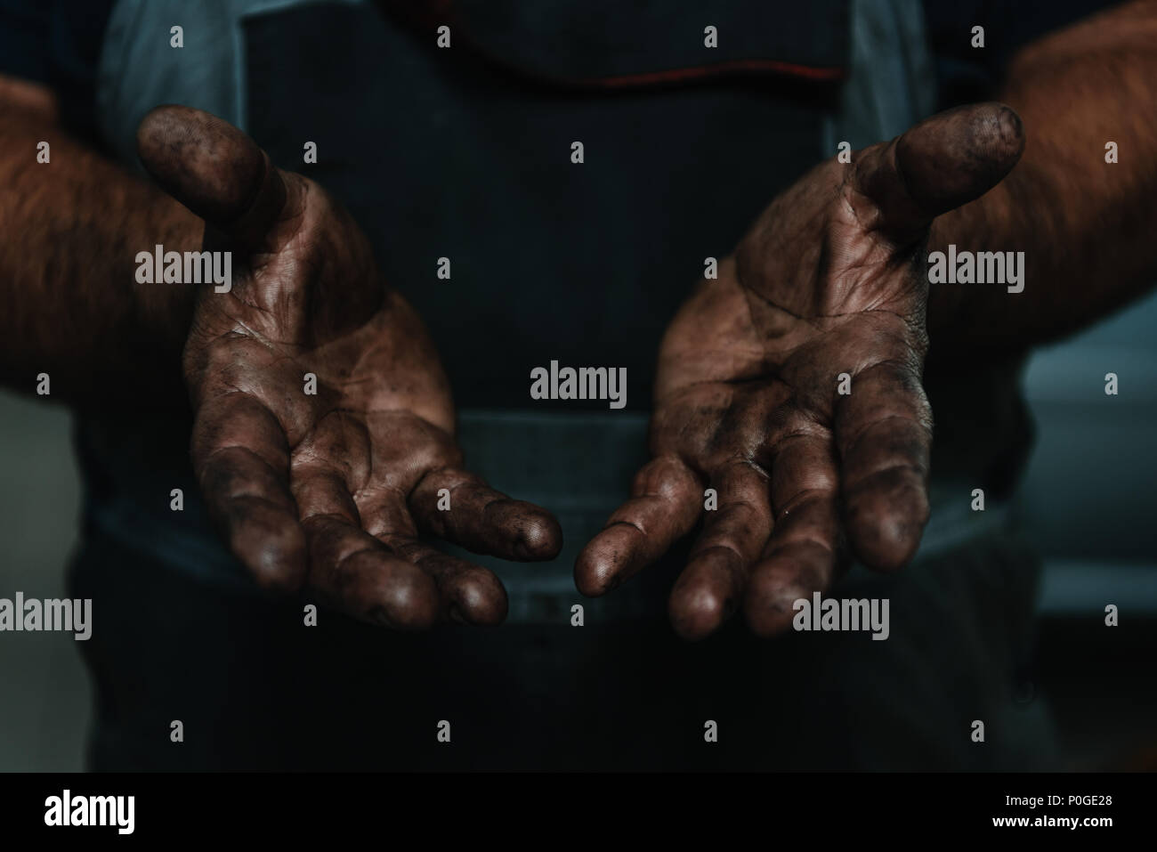 Hands covered motor oil hi-res stock photography and images - Alamy