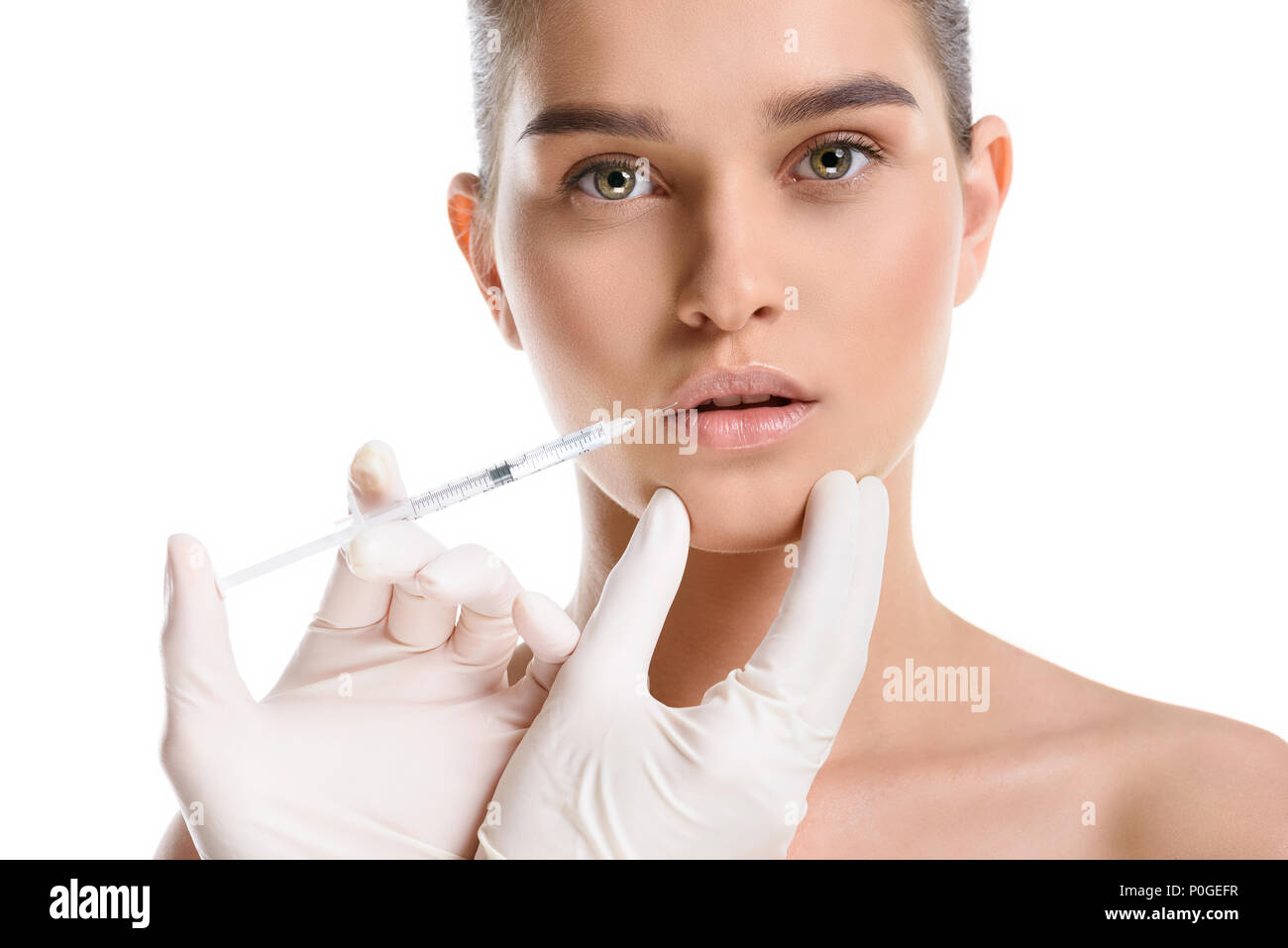 Portrait of attractive woman getting injection isolated on white Stock ...