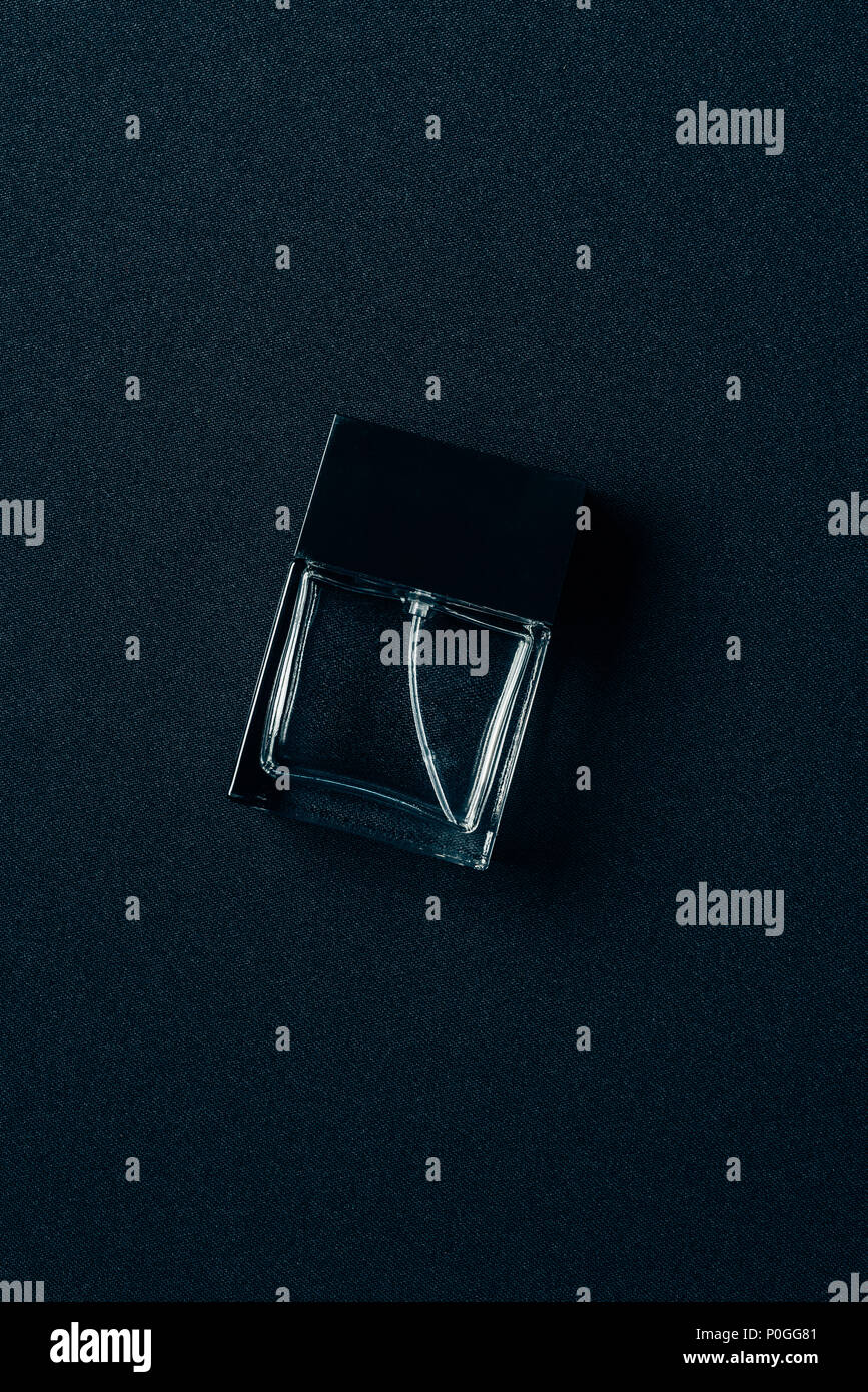 top view of bottle of aromatic perfume on black Stock Photo - Alamy