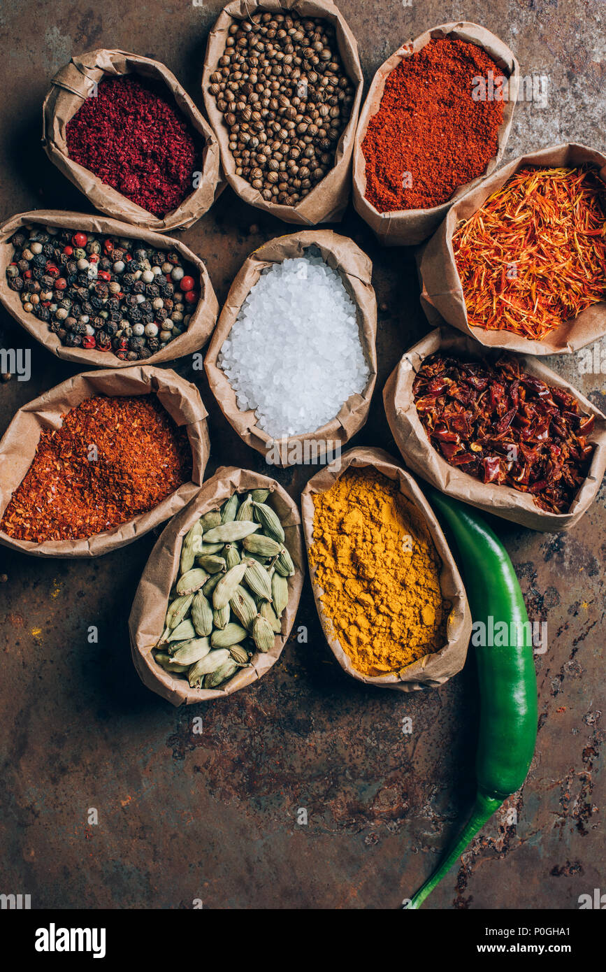 elevated view of indian spices in paper bags on table Stock Photo - Alamy