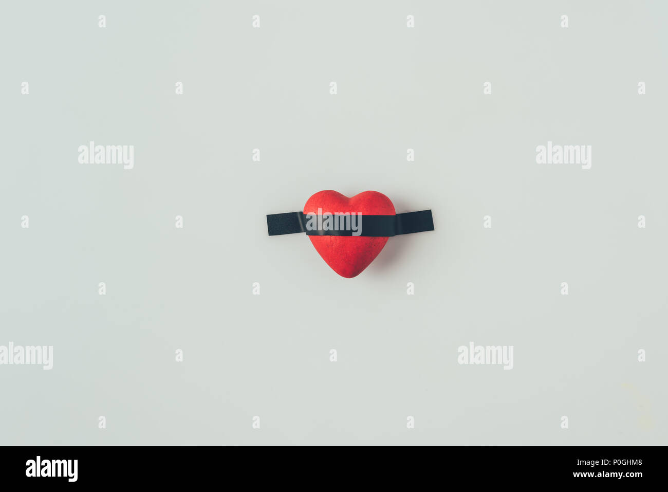 top view of red heart under insulating tape isolated on white Stock ...