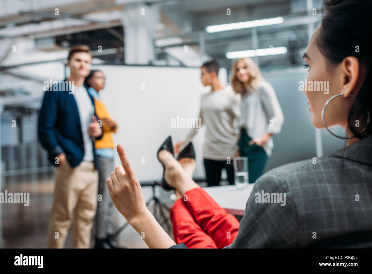 lady boss talking to workers in front of presentation board Stock Photo ...