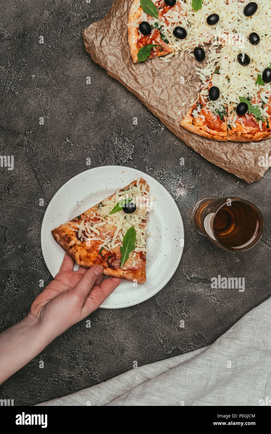 Female hand taking pizza slice hi-res stock photography and images - Alamy