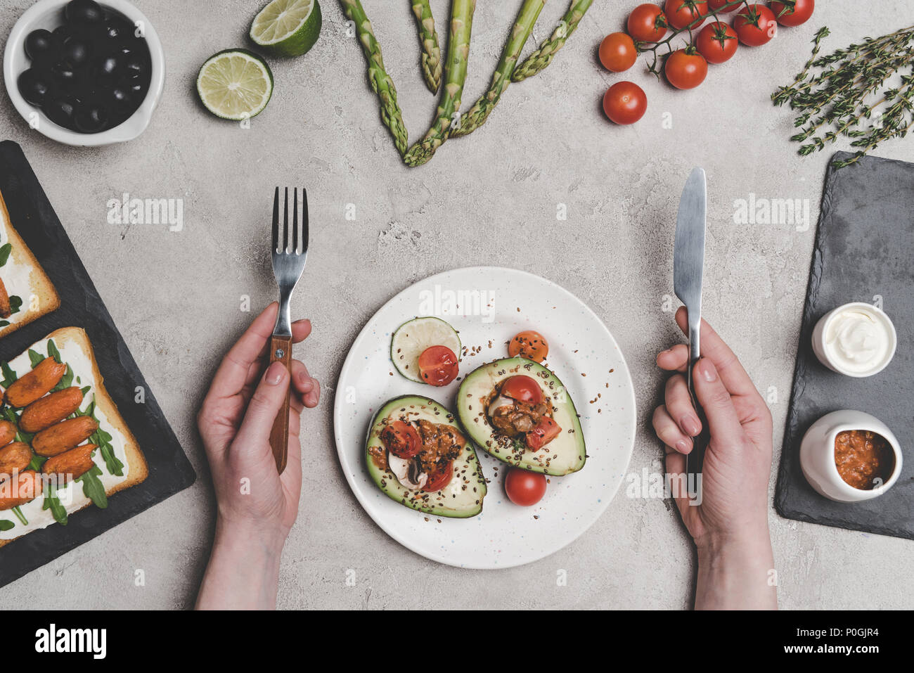 partial top view of person eating delicious healthy meal with organic ...