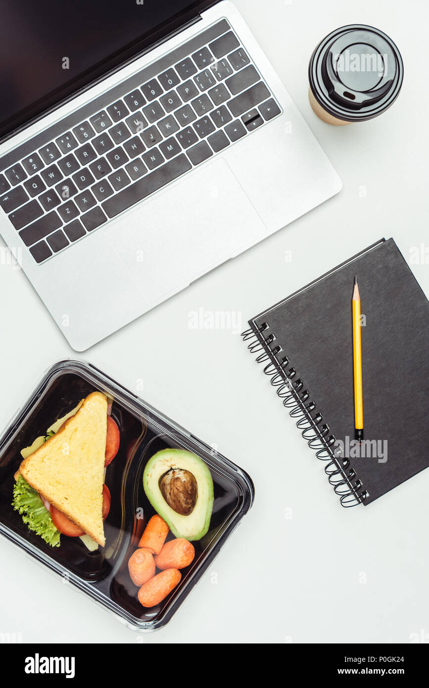 top view of laptop and food in lunch box isolated on white Stock Photo ...