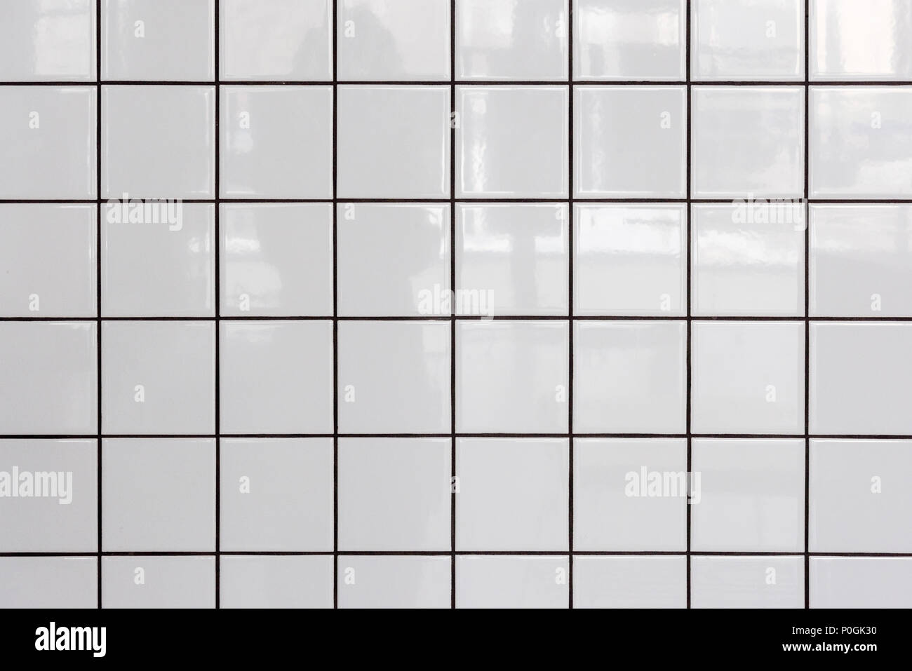 Wall of white glossy tiles with reflection Stock Photo - Alamy