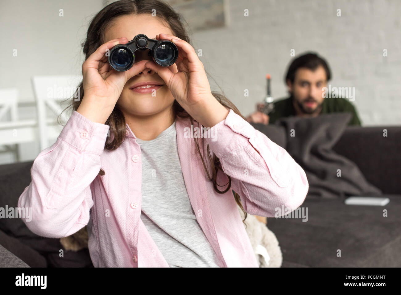Child hiding behind parent hi-res stock photography and images - Alamy