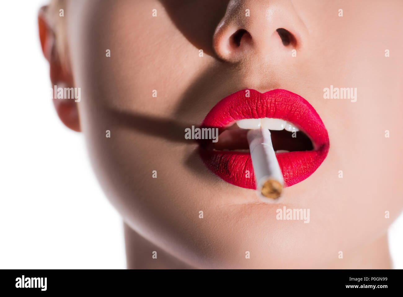 cropped image of woman with makeup smoking cigarette isolated on white ...