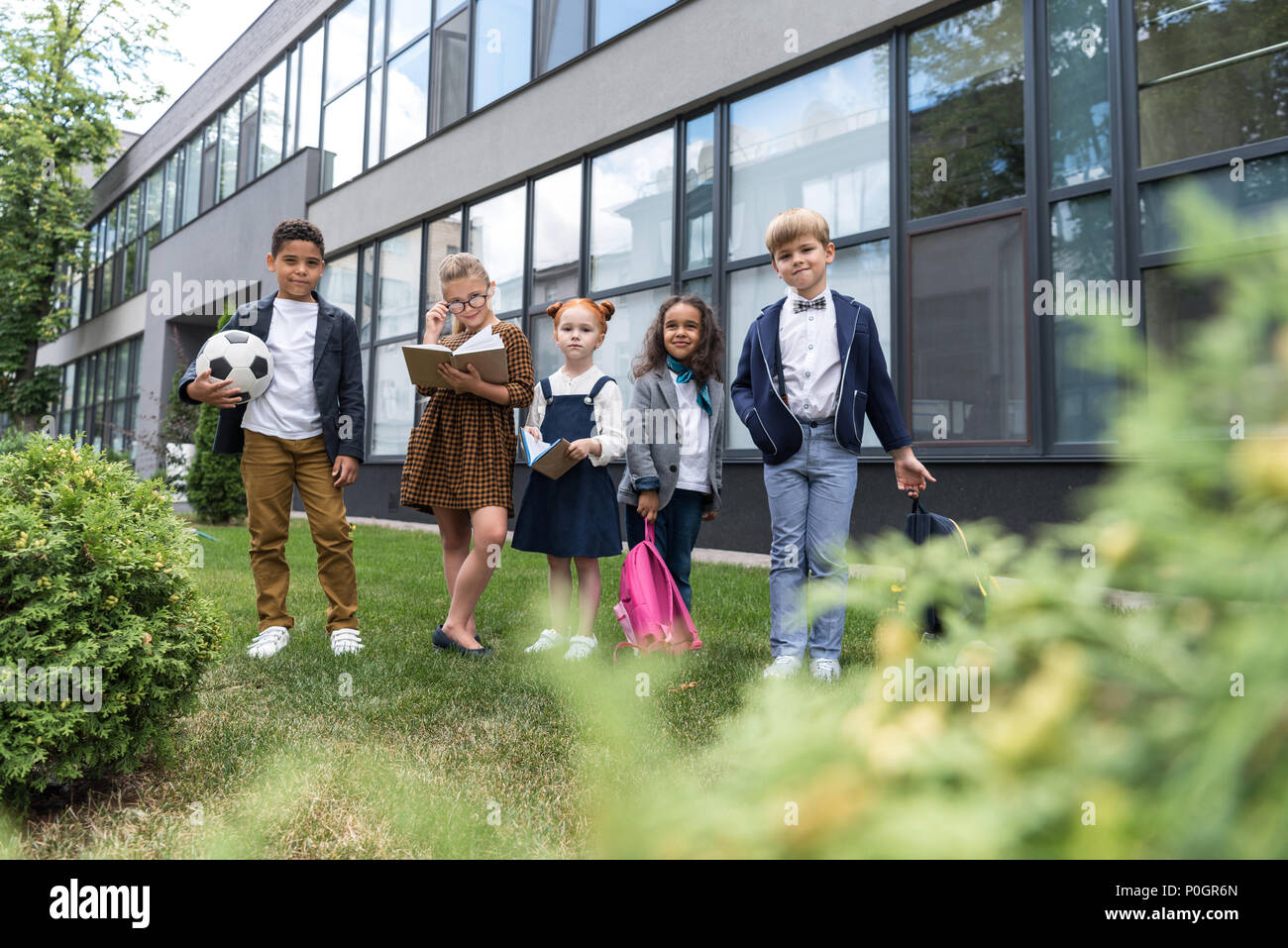 Children standing outside school hi-res stock photography and images ...