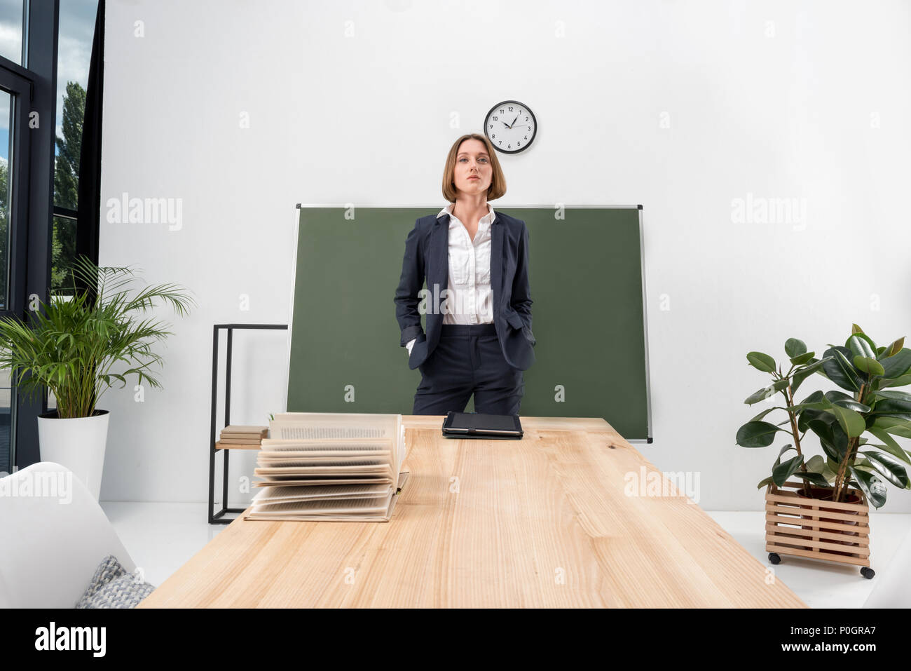 Teacher alone in classroom hi-res stock photography and images - Alamy