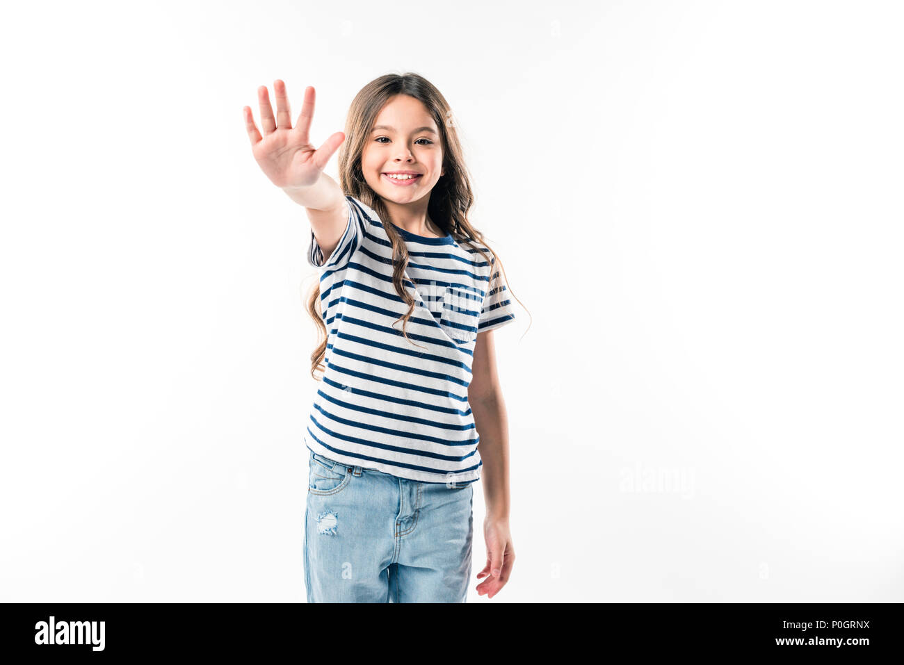 Smiling kid standing and giving high five isolated on white Stock Photo ...