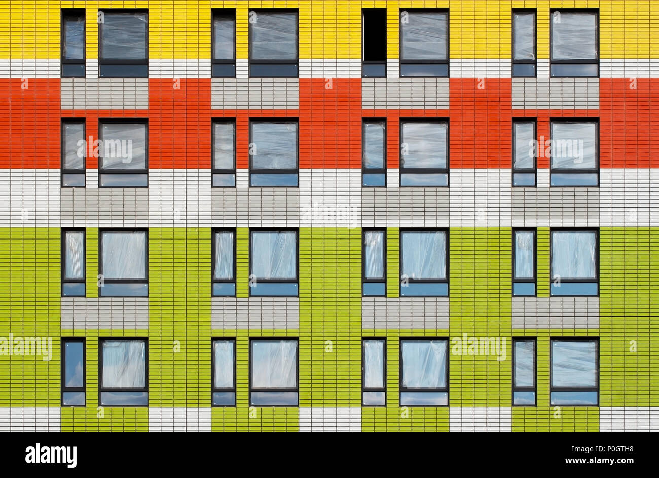 Windows of under construction high-rise building Stock Photo - Alamy