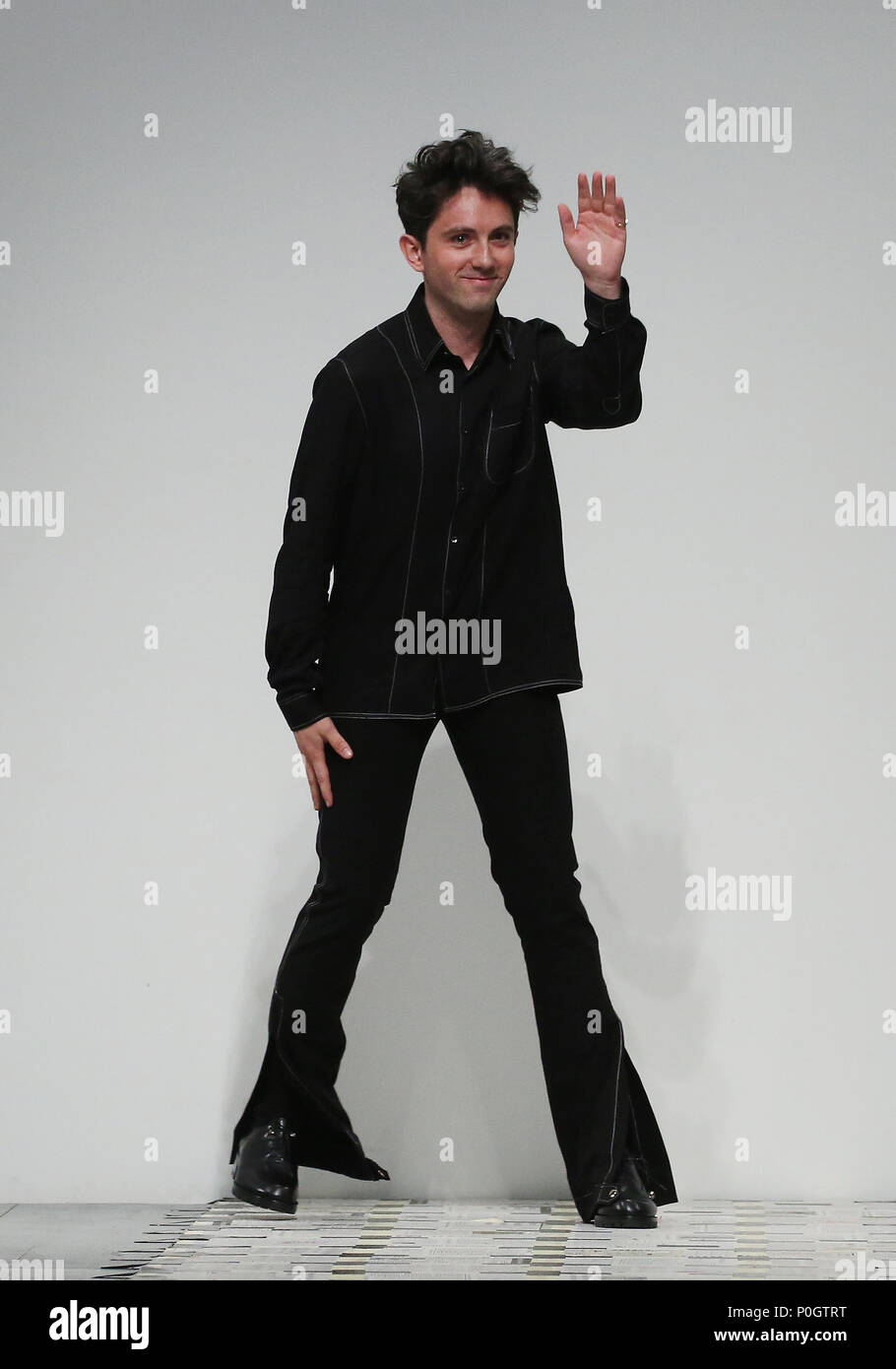 Designer Daniel W. Fletcher acknowledges the audience following his ...