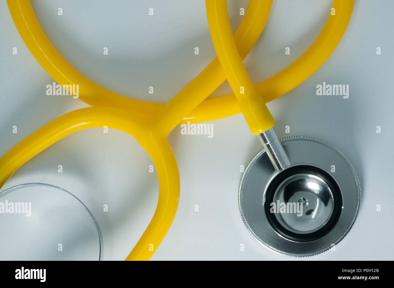 Yellow Stethoscope on white background Stock Photo - Alamy