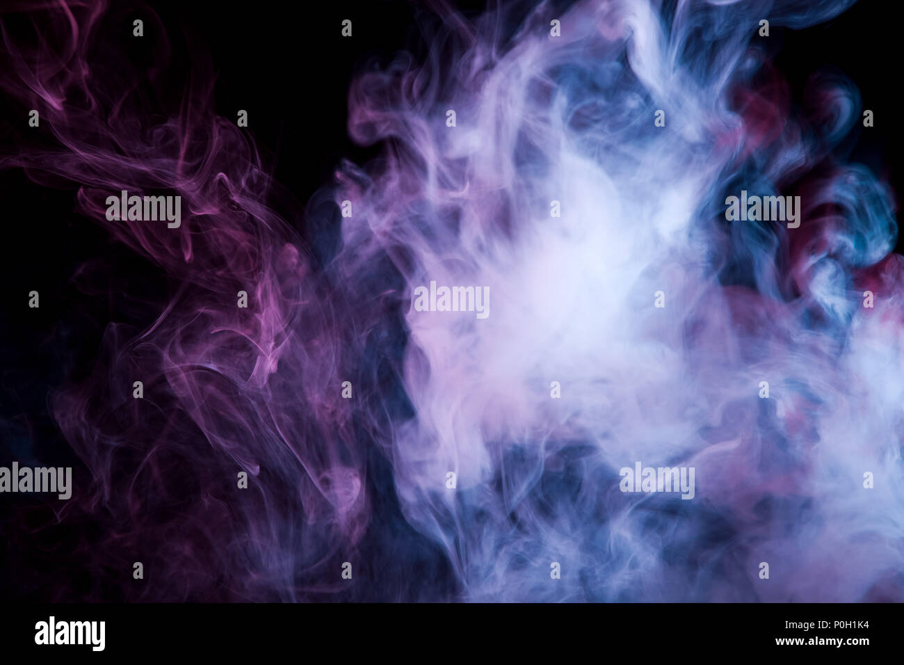 Thickpink and purple smoke on a black isolated background. Background ...