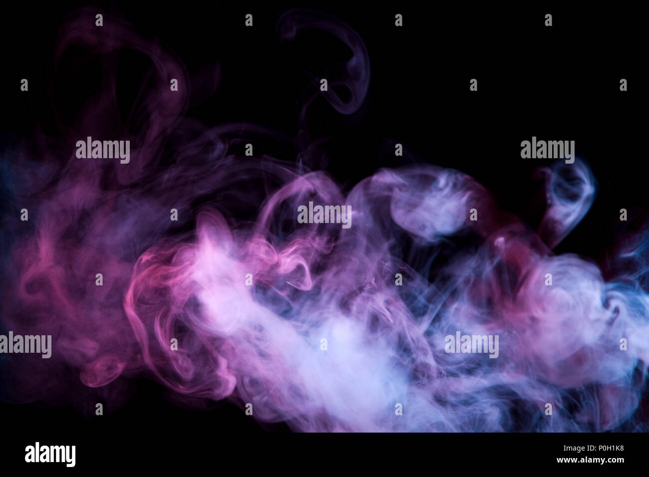 Thickpink and purple smoke on a black isolated background. Background ...