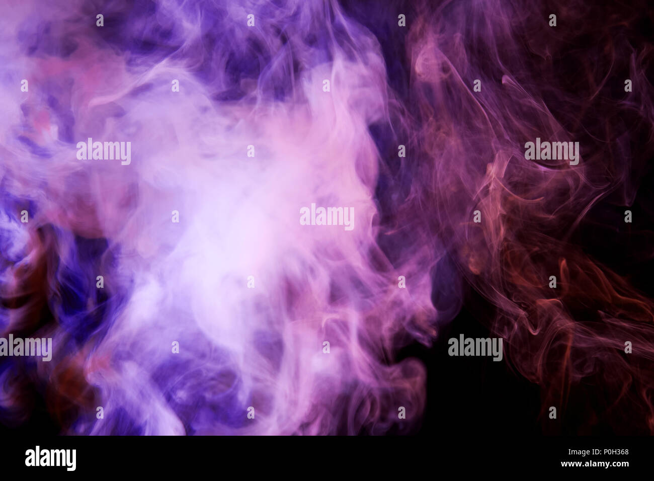 Thickpink and purple smoke on a black isolated background. Background ...