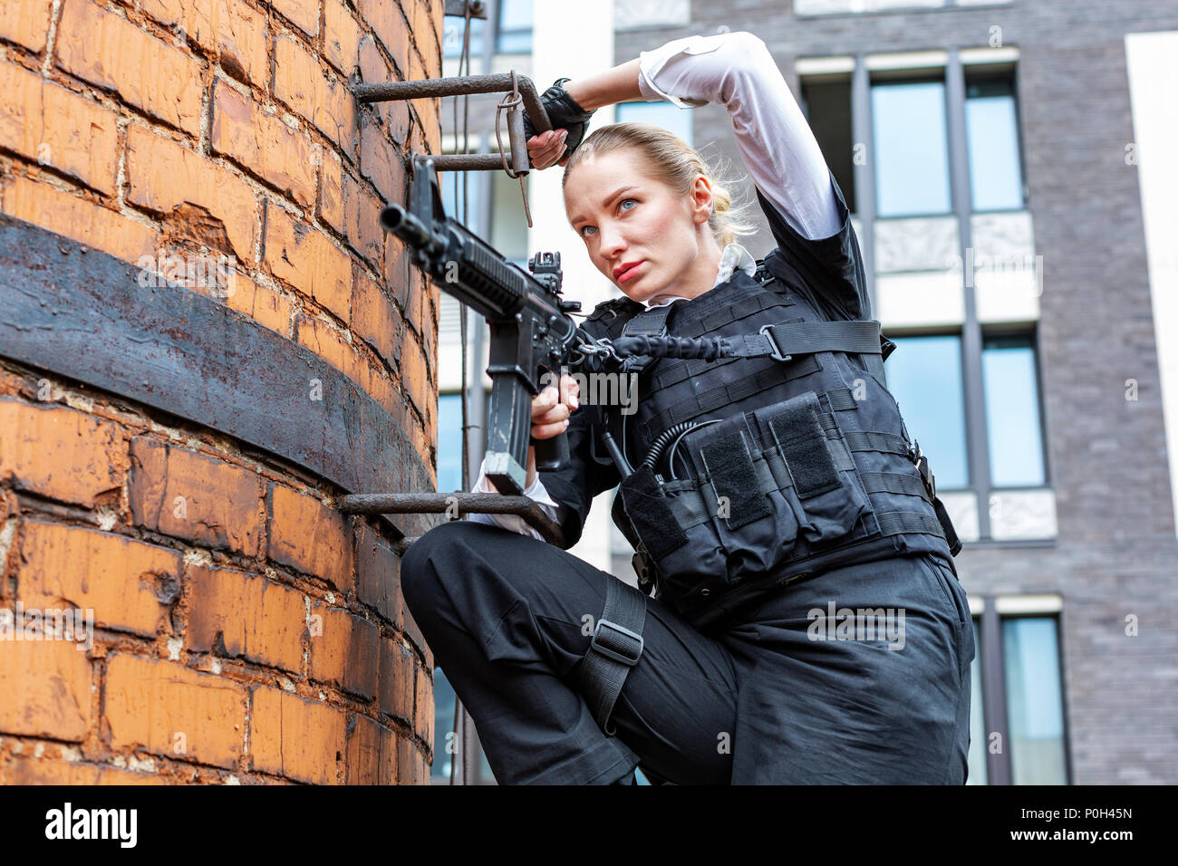 Powerful Woman Holding Gun. War Action Movie Style Stock Photo - Alamy