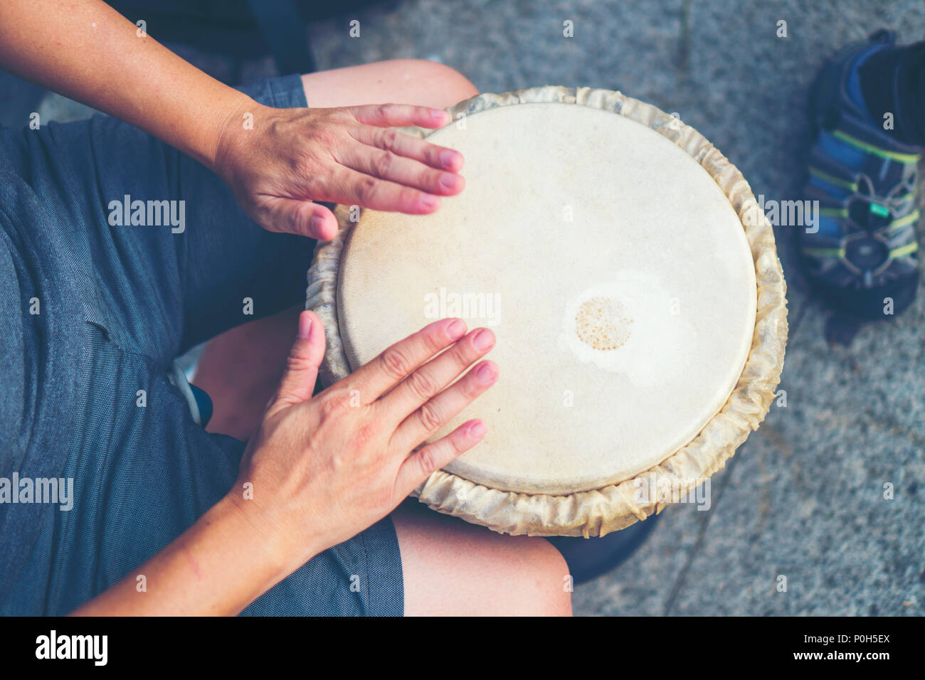 People hands playing music at djembe drums, vintage filter image Stock ...