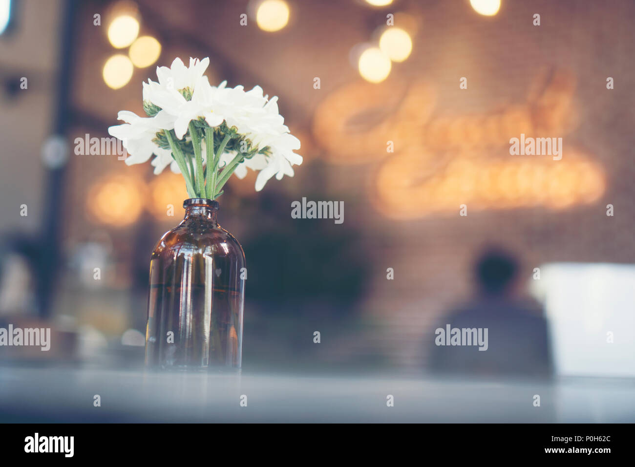 flower in vase in coffee cafe Stock Photo - Alamy