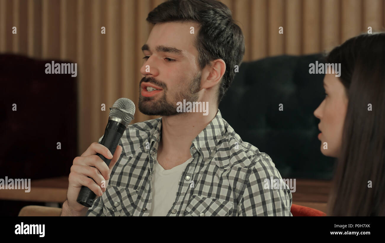 Attractive young cheerful man singing hi-res stock photography and ...