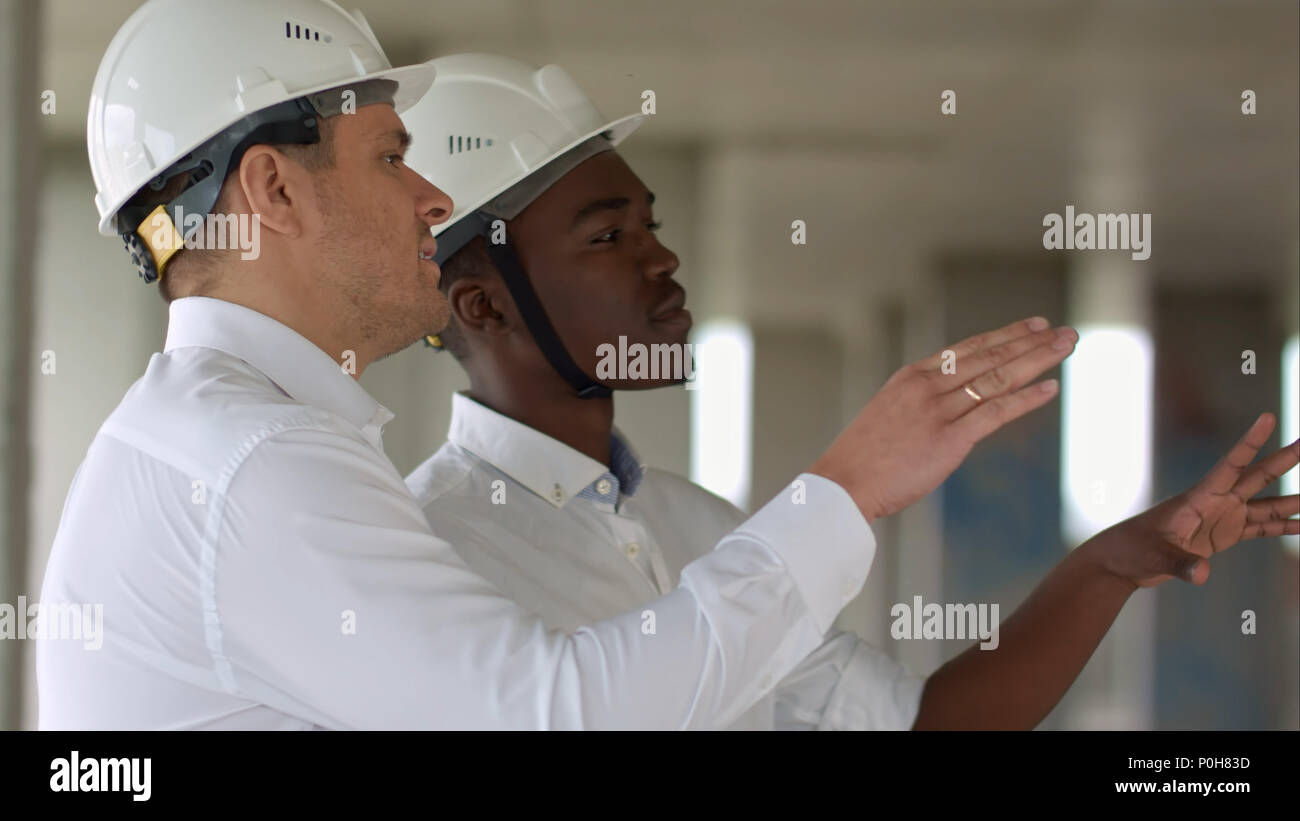 Engineer discussing construction plans hi-res stock photography and ...