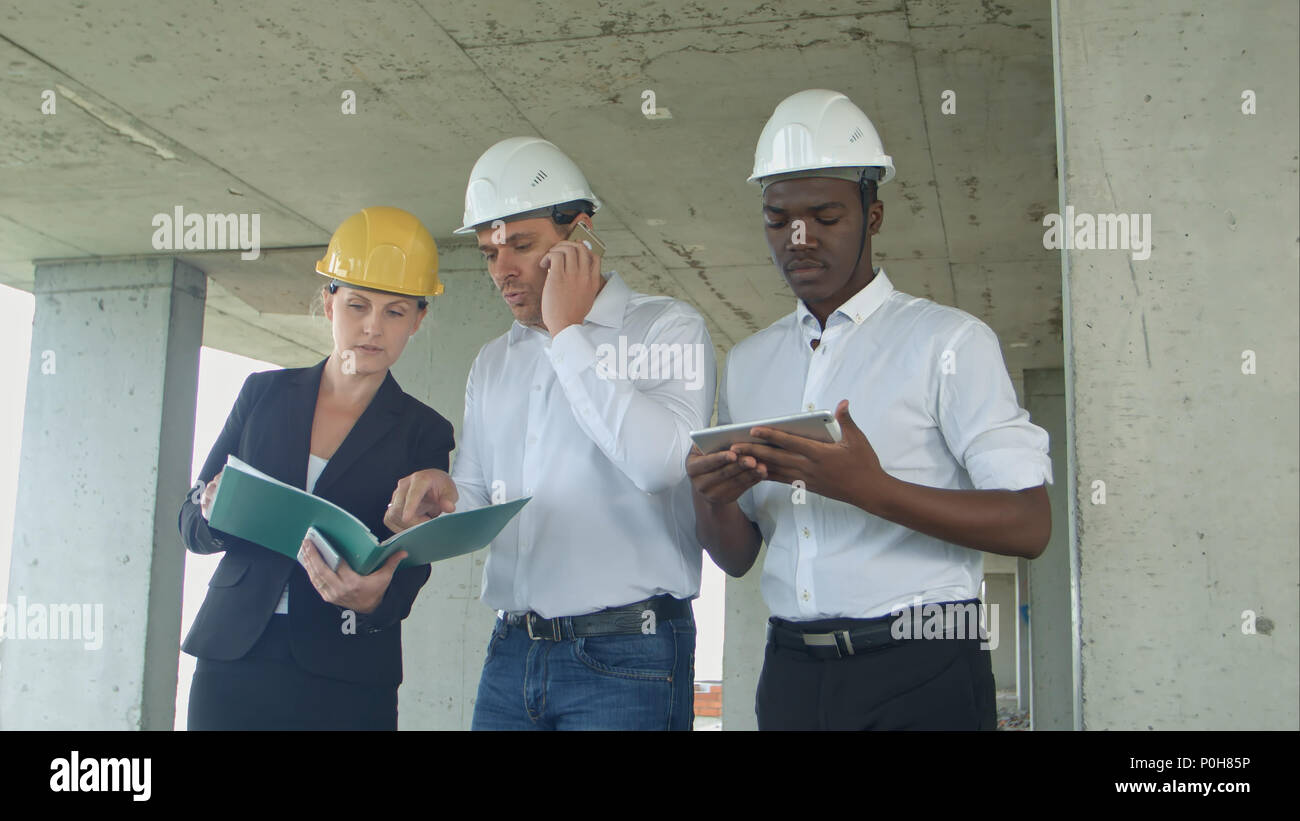 Group of engineers and experts discuss about construction site Stock ...