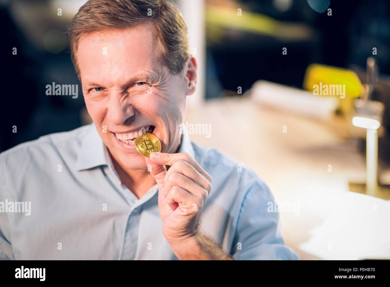 Biting coin hi-res stock photography and images - Alamy