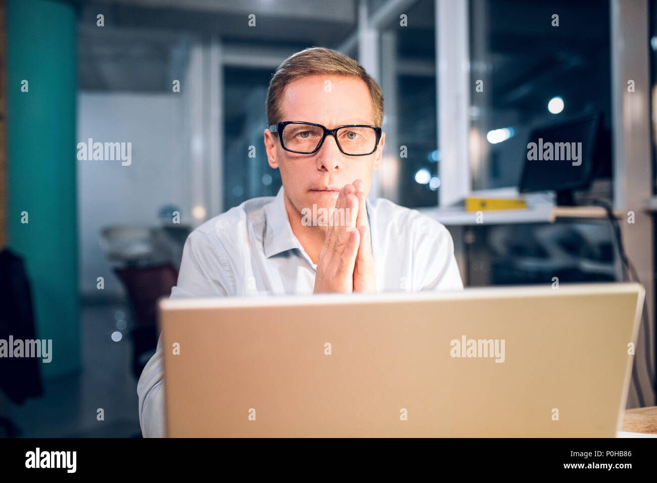 Businessman working with computer late at night Stock Photo - Alamy