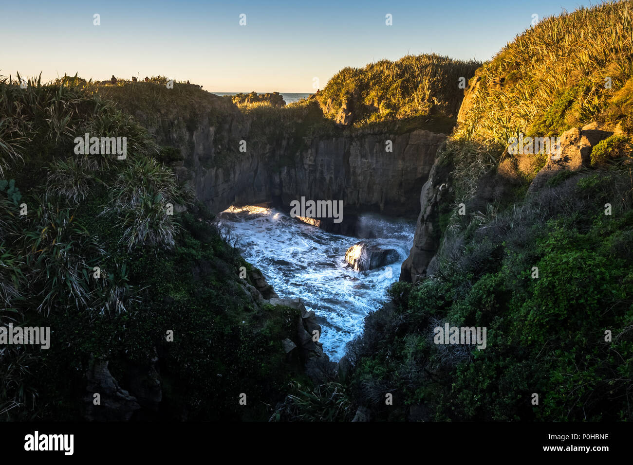 Sunset at Punakaiki pancake rocks and blowholes in the west coast of ...